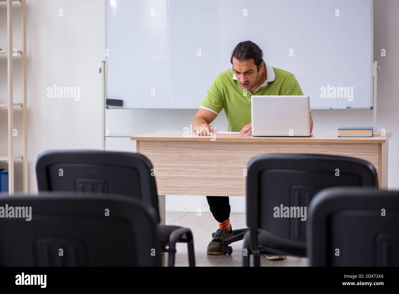 Young student in business presentation concept Stock Photo - Alamy