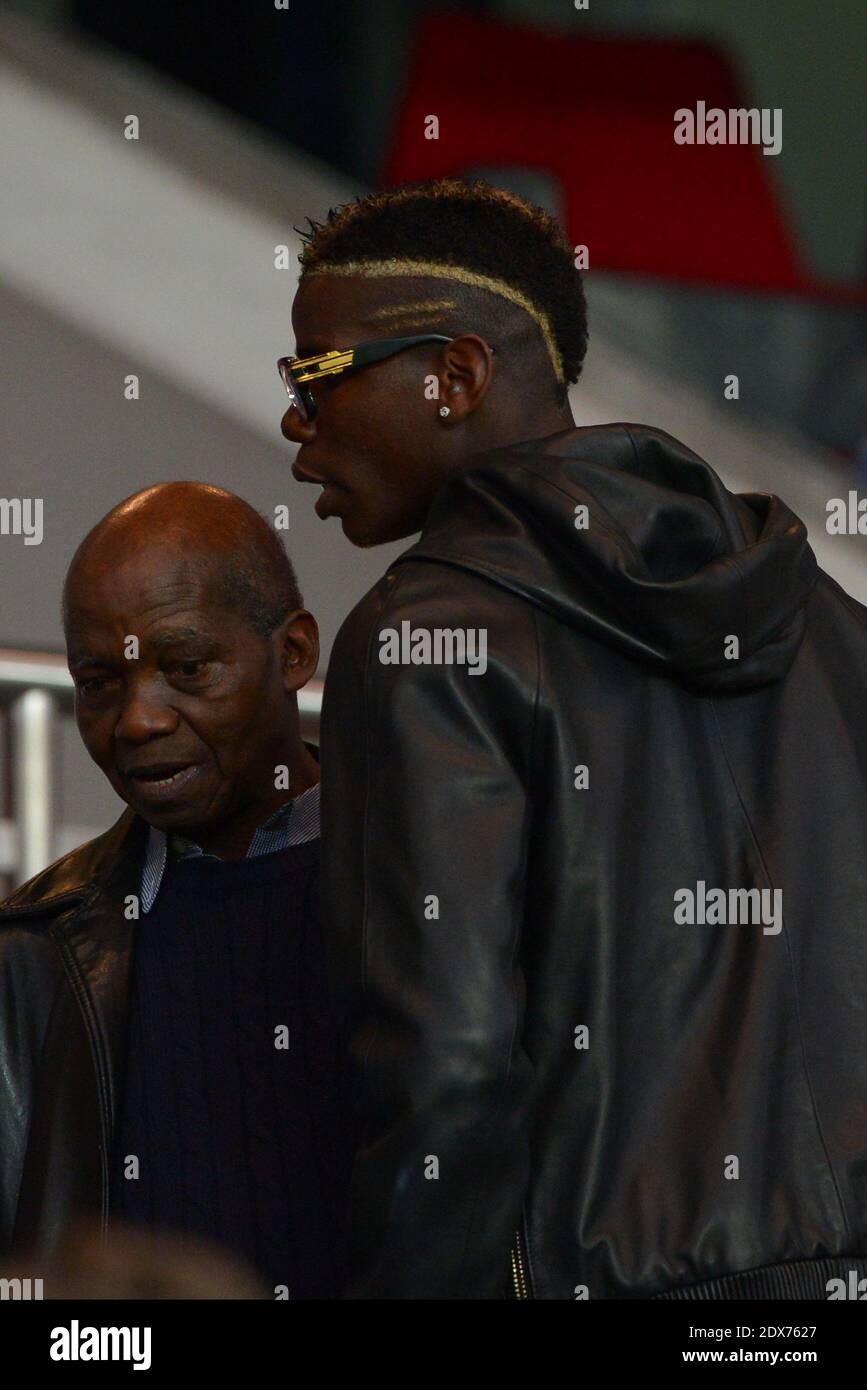 Paul Pogba and his parents attending the French First League soccer ...