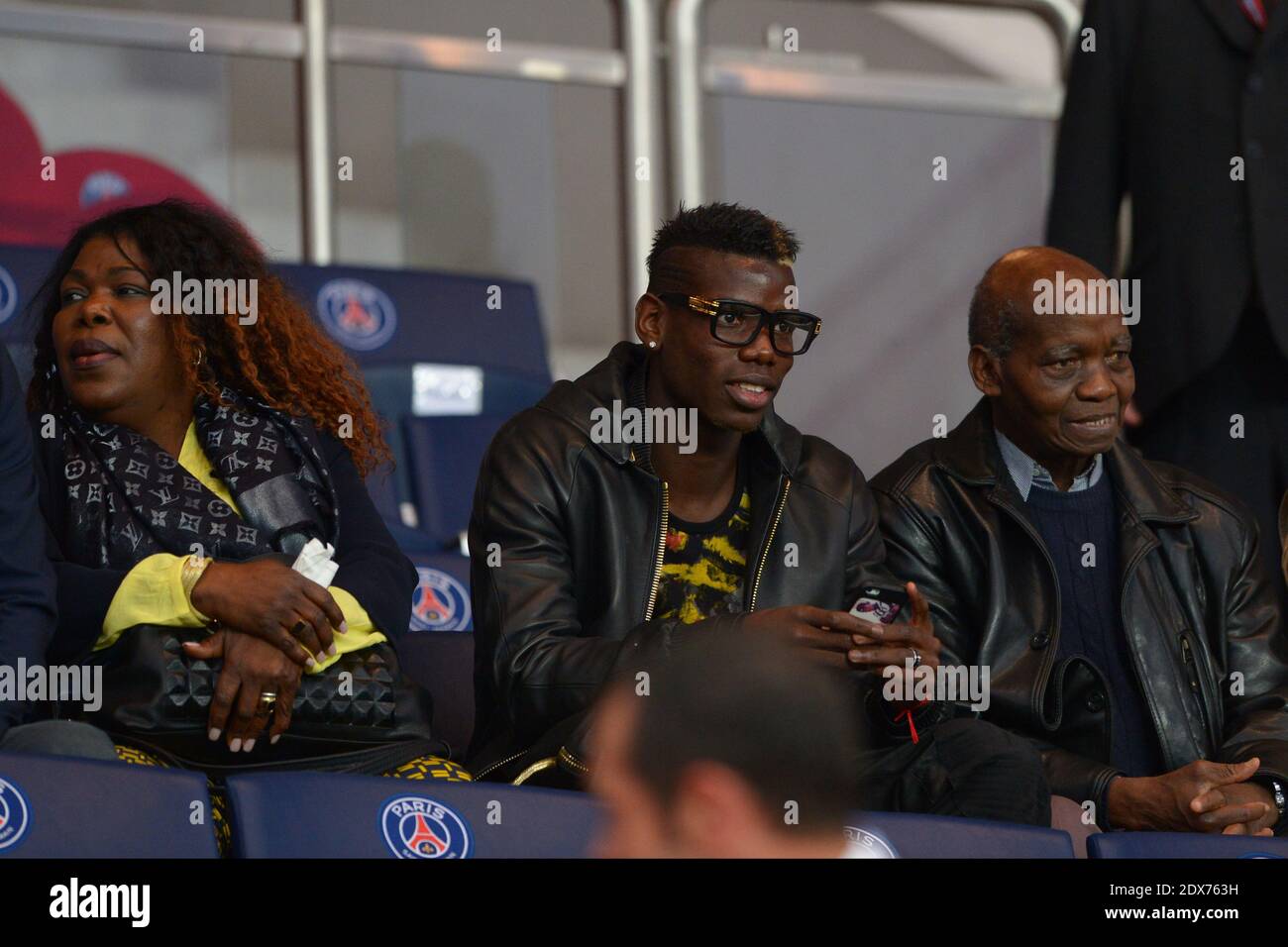 Paul Pogba and his parents attending the French First League soccer ...