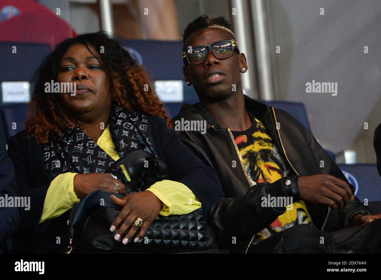 Paul Pogba and his parents attending the French First League soccer ...