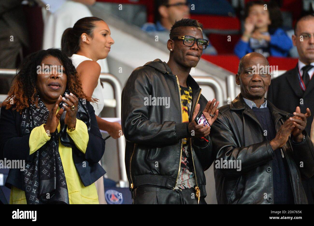 Paul Pogba and his parents attending the French First League soccer ...