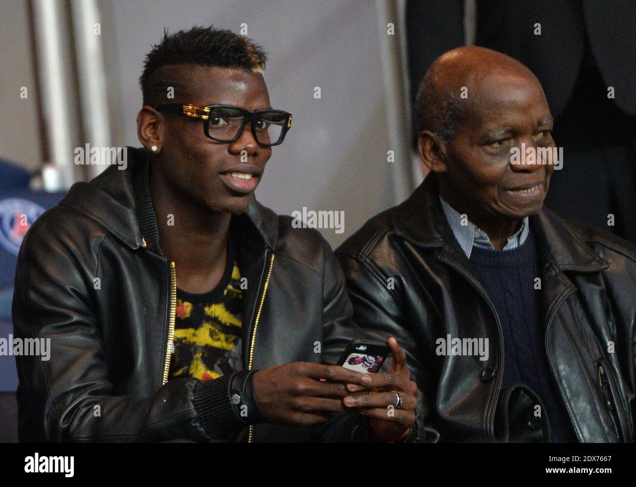 Paul Pogba and his parents attending the French First League soccer ...