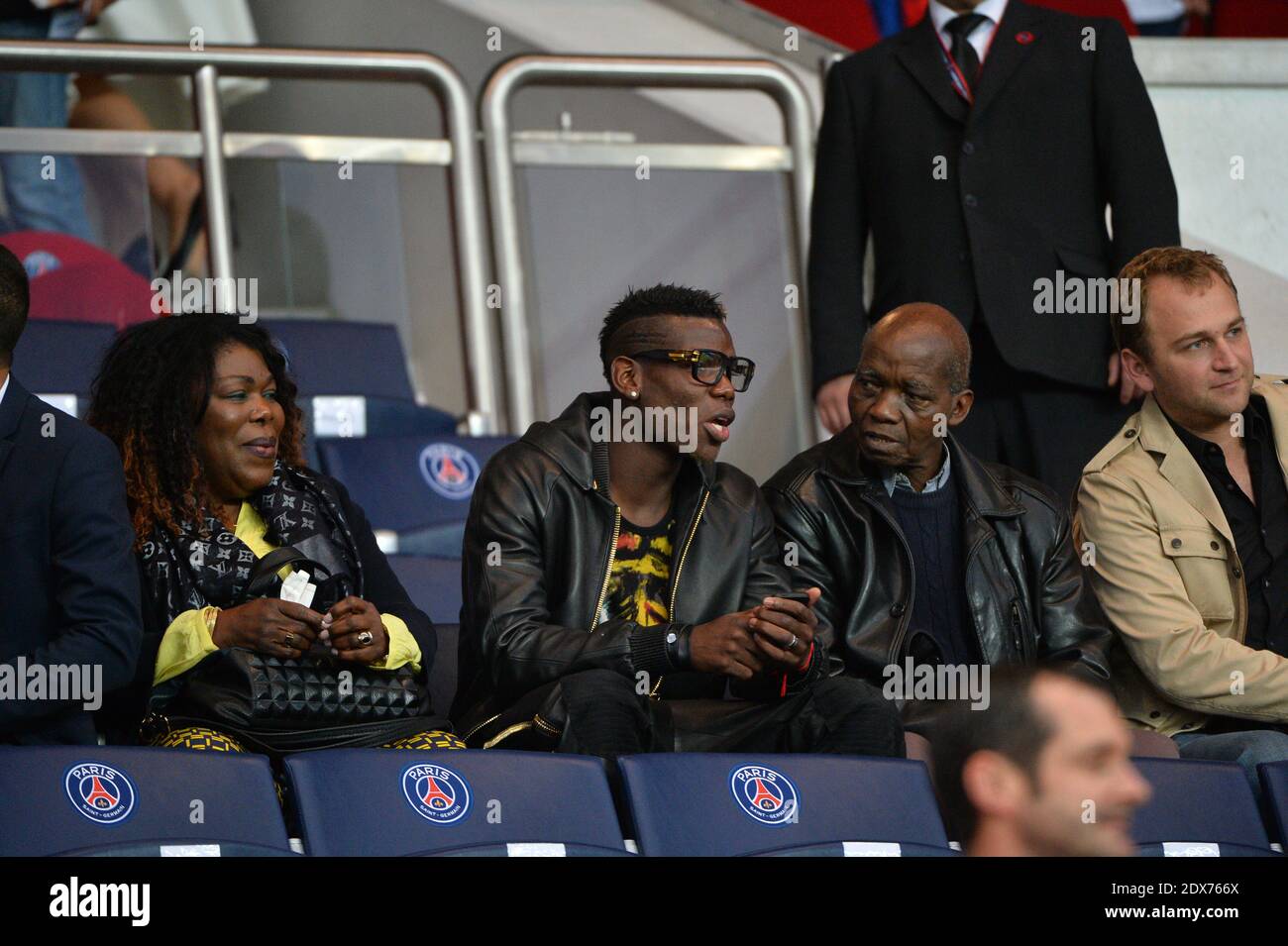 Paul Pogba and his parents attending the French First League soccer ...