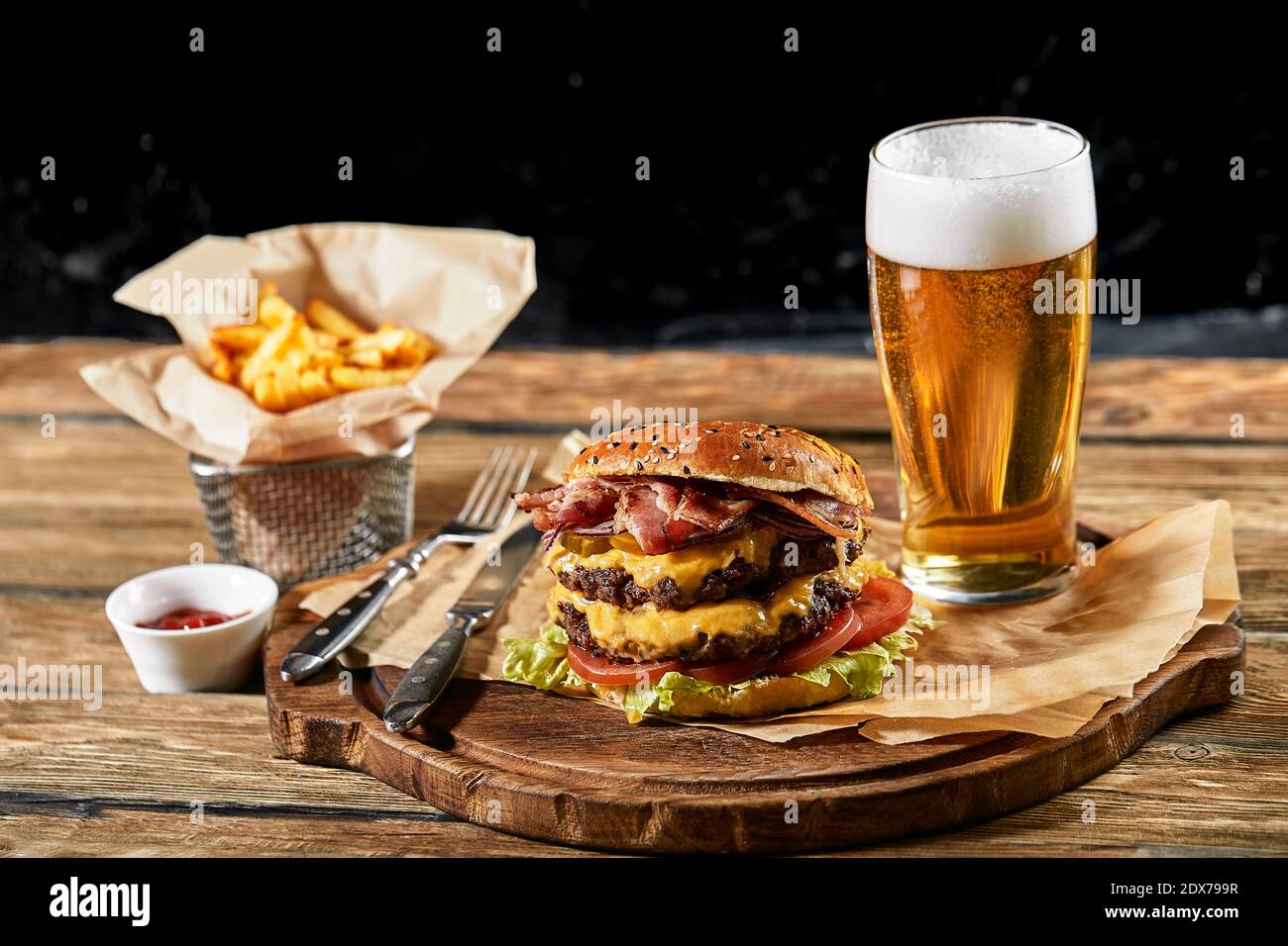 Set of hamburger beer and french fries. A standard set of drinks and ...