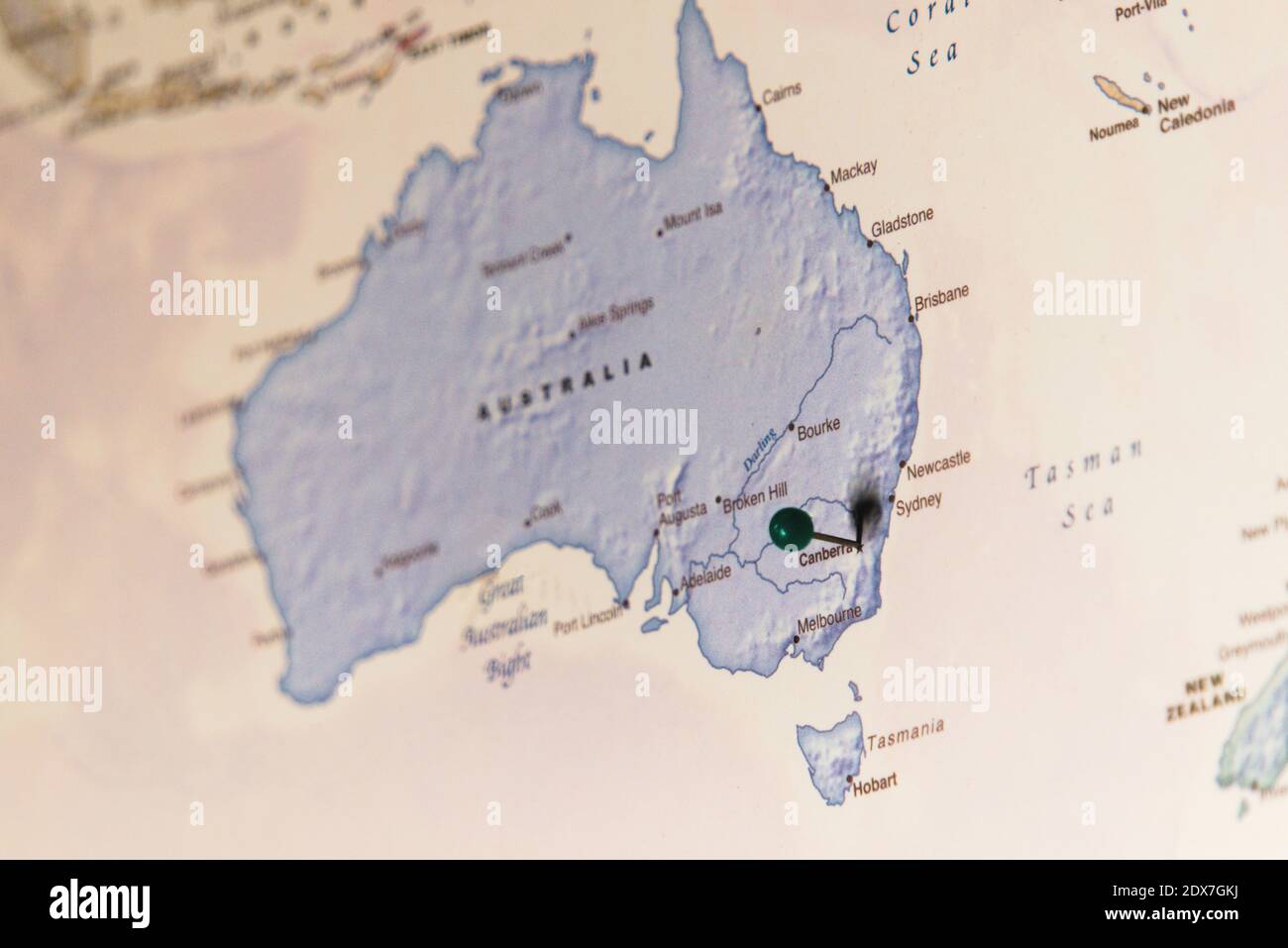 Map of Australia with pinned city of Canberra. Photo from bottom angle ...