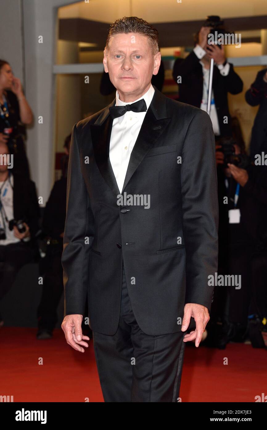 Director Andrew Niccol attending the premiere for the film Good Kill ...