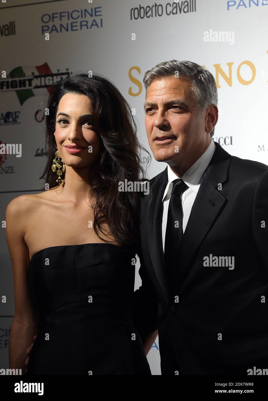 US actor-director George Clooney arrives with his fiancee, British ...