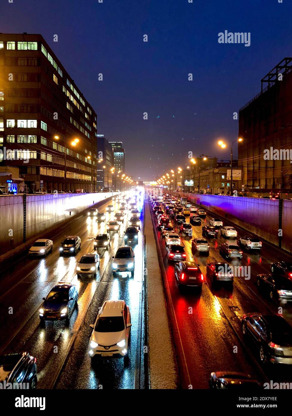 Traffic On City Street At Night Stock Photo - Alamy