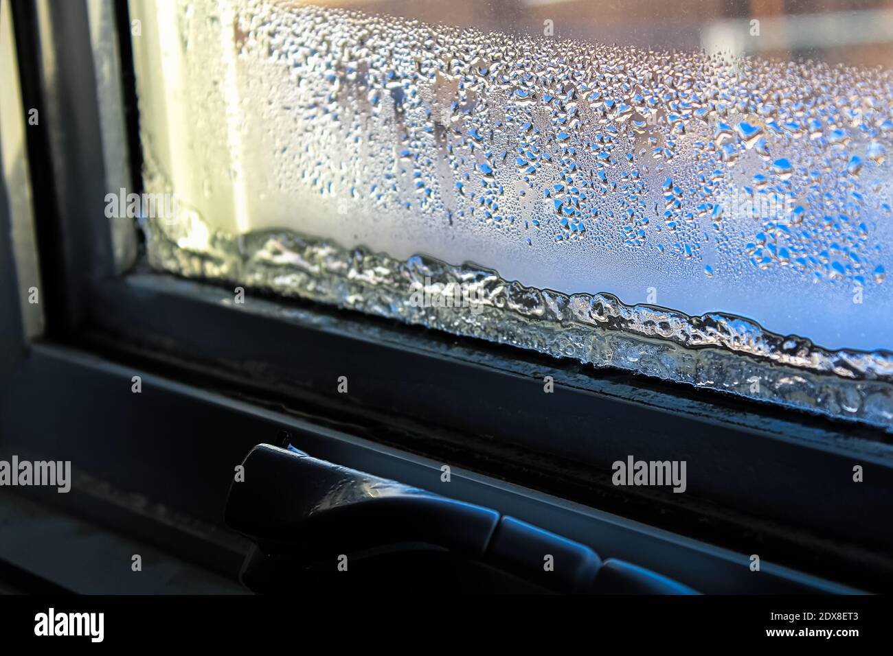 Ice and condensation forming on a window Stock Photo - Alamy