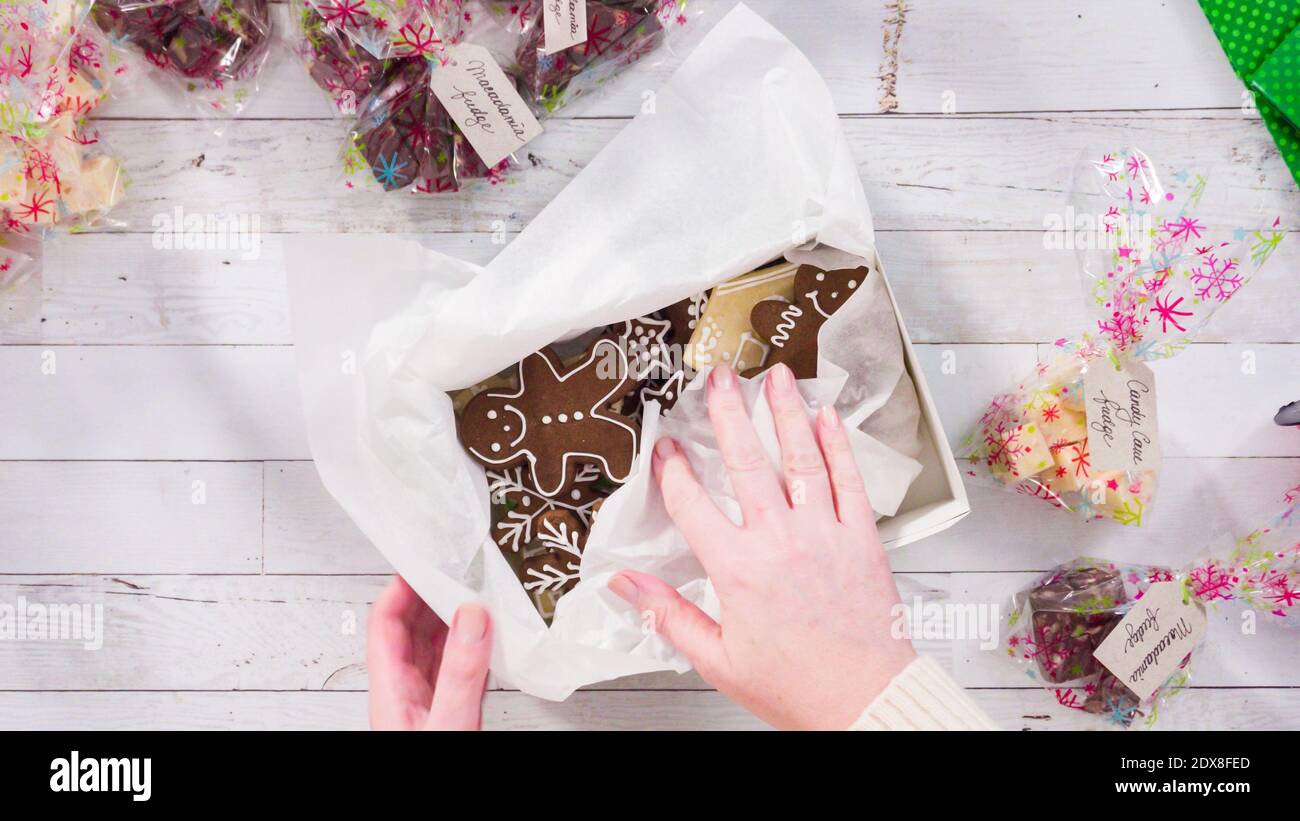 Flat lay. Step by step. Packaging homemade fudge and cookies into a ...