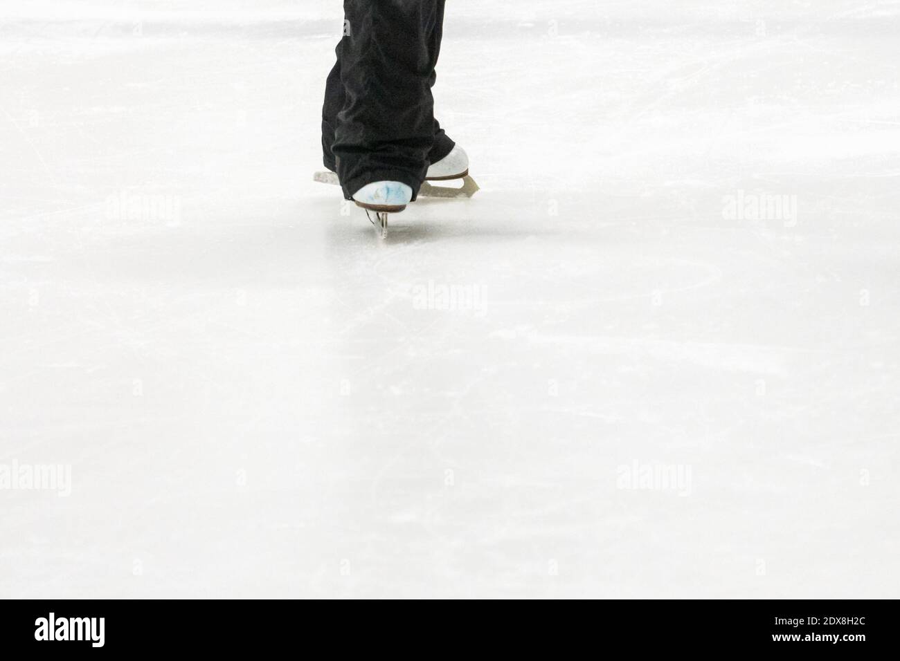 View of figure skating coach feet at the figure skating lesson Stock ...