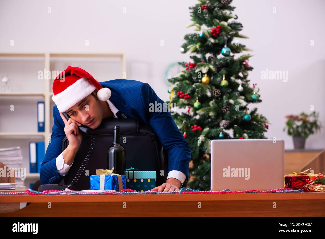 Employee in office during christmas party Stock Photo - Alamy