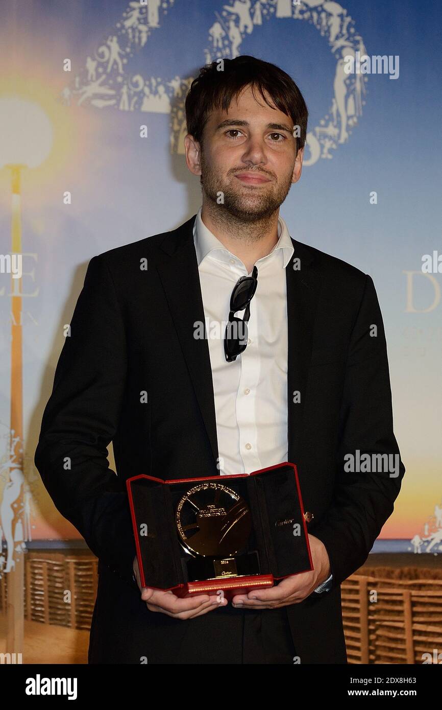 David Robert Mitchell pose with the Critic's Prize during the closing ...