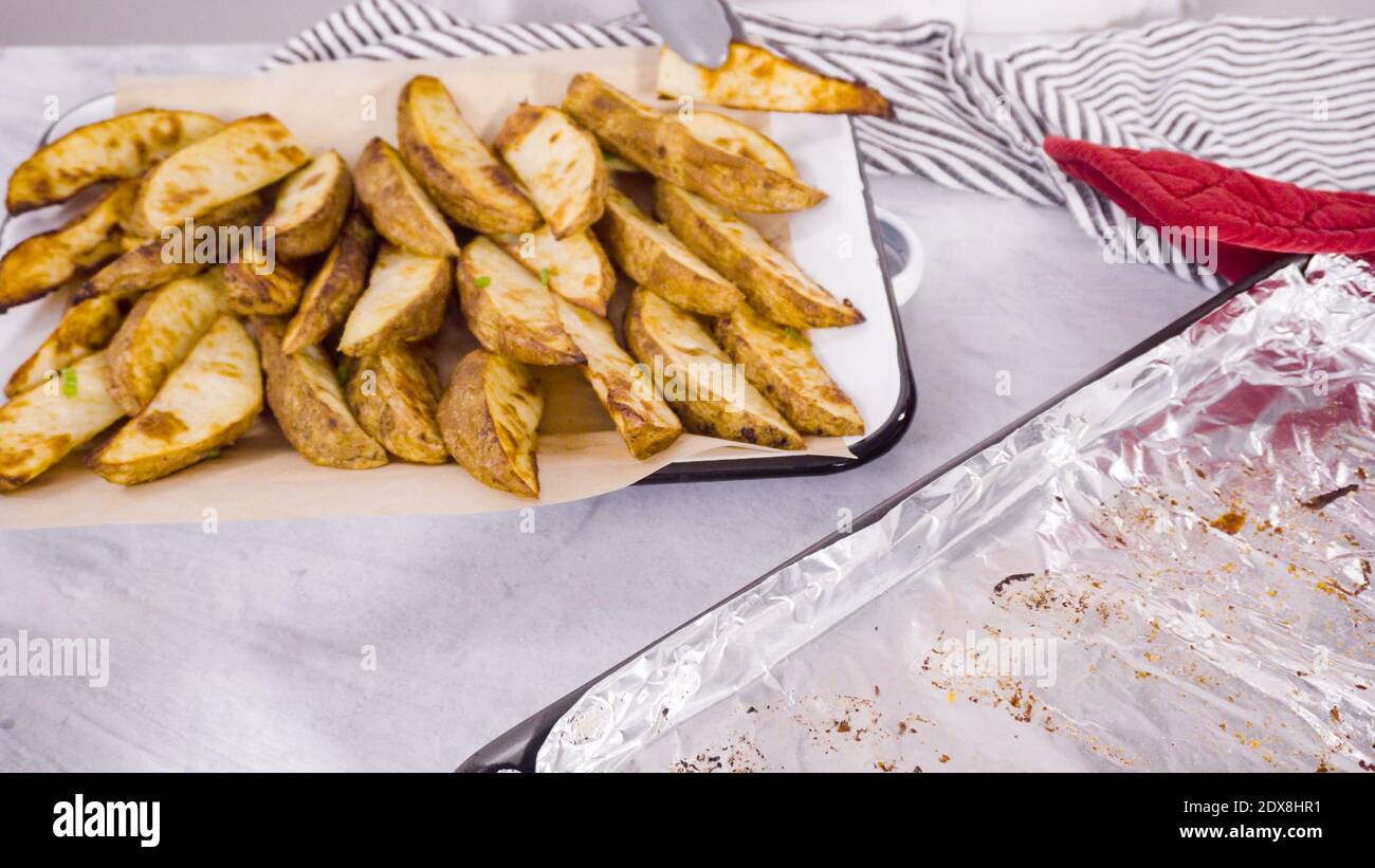 Preparing russet potatoes in wedges hi-res stock photography and images ...