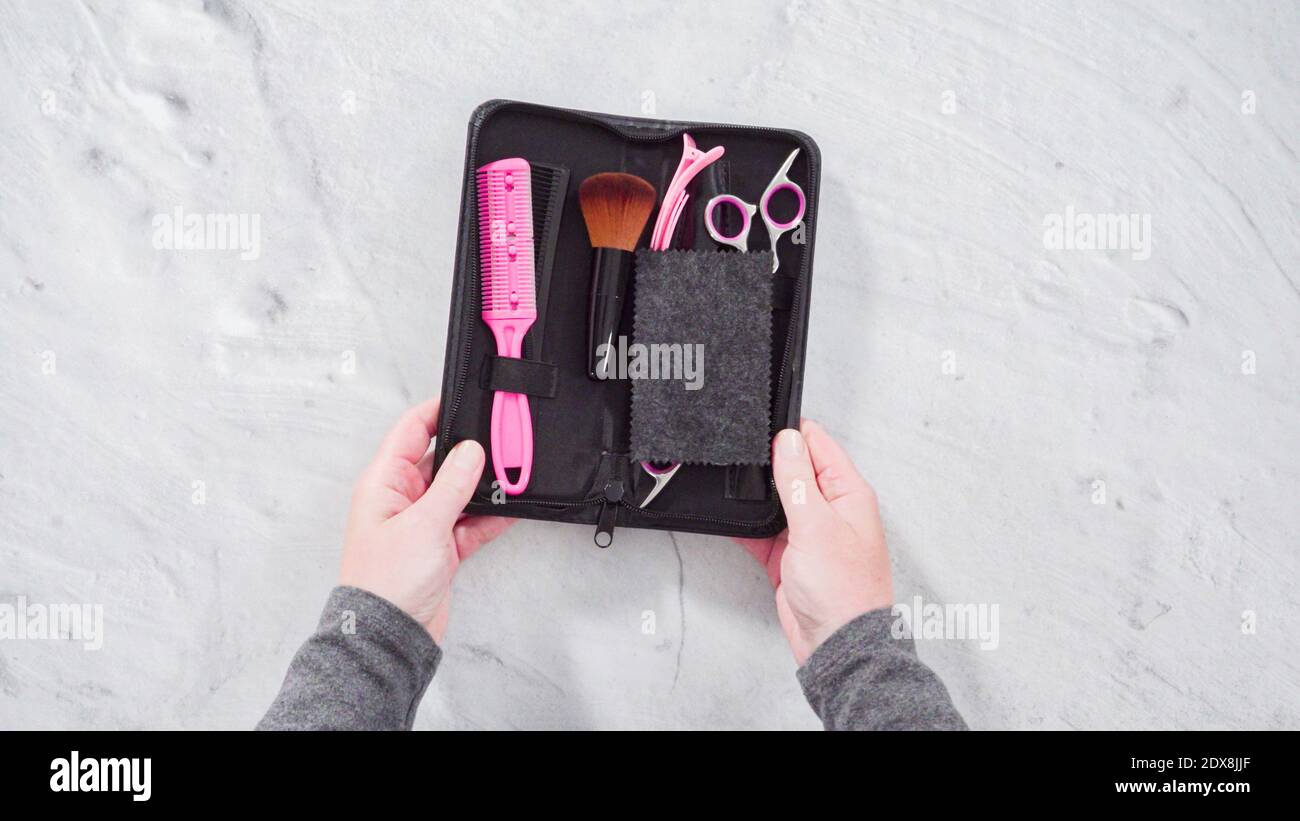 Flat lay. Pink hair cutting scissors set Stock Photo - Alamy