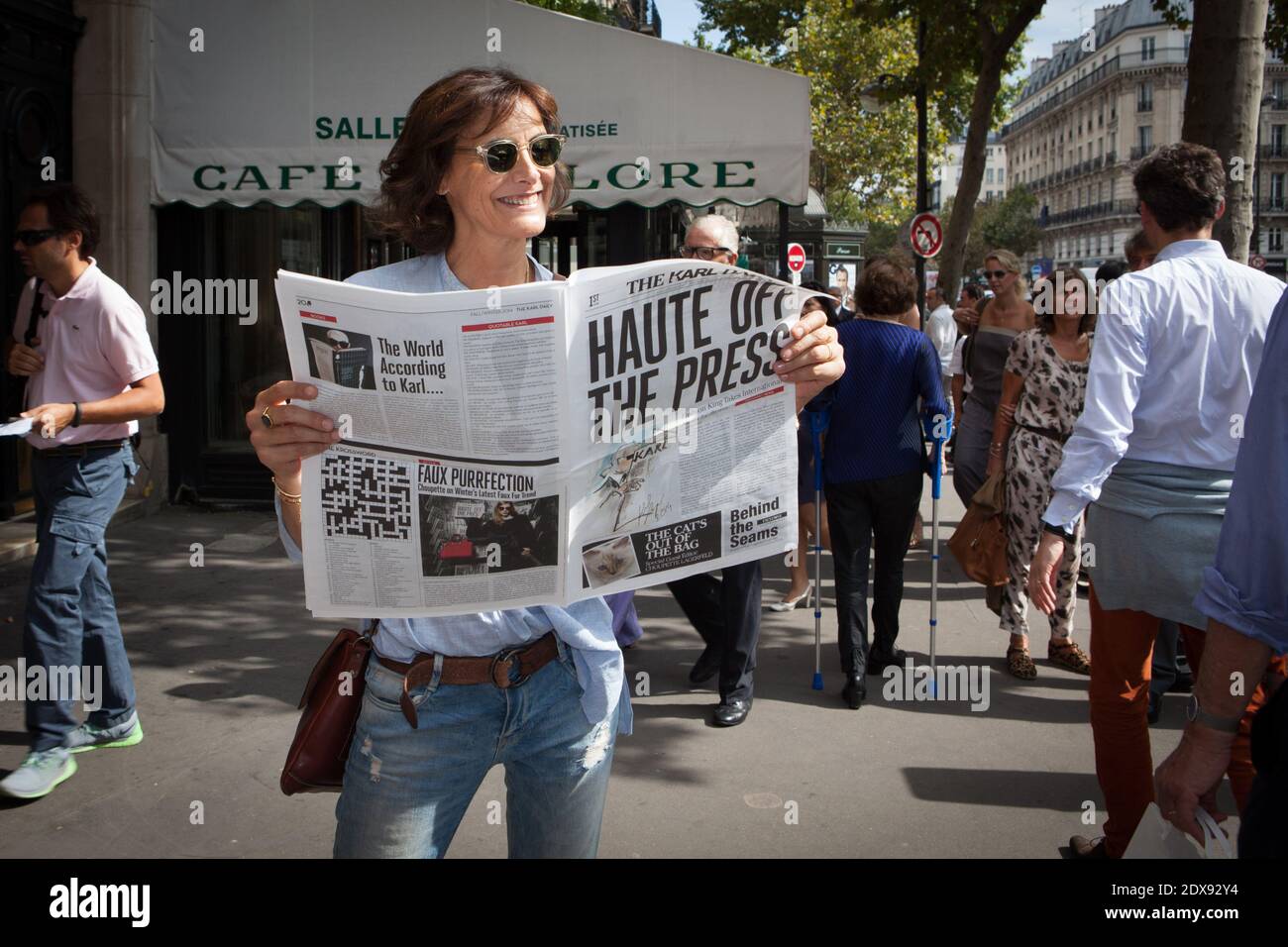 Exclusive - Former supermodel Ines de La Fressange reads a copy of Karl ...