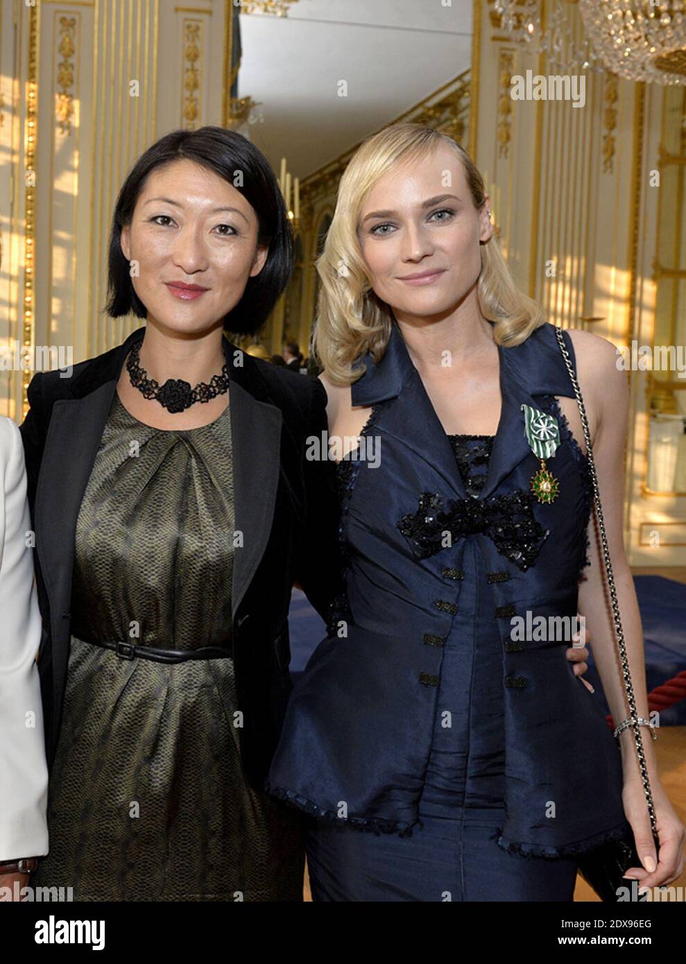 Actress Diane Kruger (R) receives the insignia of Officer of the Order ...