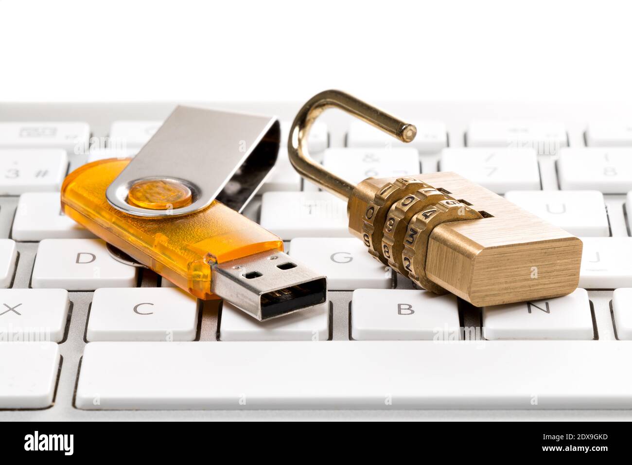 Close-up Of Padlock And Usb Stick On Computer Keyboard Against White ...