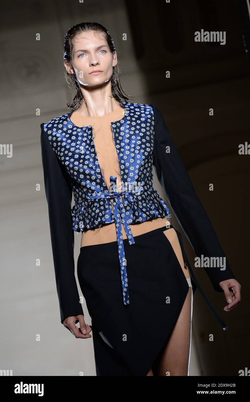 A model displays a creation by designer Raf Simons for his Spring ...