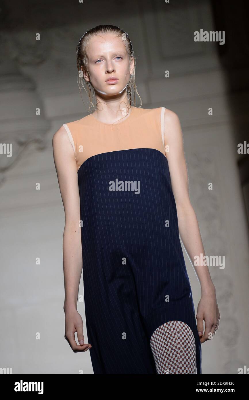 A model displays a creation by designer Raf Simons for his Spring ...