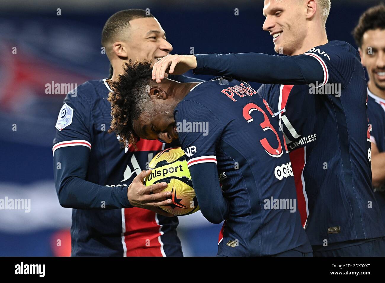 Paris, France. 23rd Dec 2020. Timothee Pembele of PSG celebrates with ...