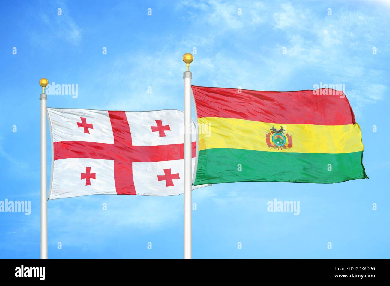Georgia and Bolivia two flags on flagpoles and blue sky Stock Photo - Alamy