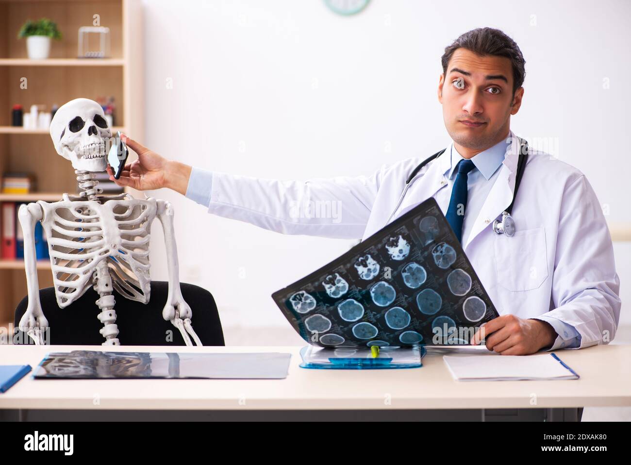 Young doctor radiologist and skeleton patient in the clinic Stock Photo ...