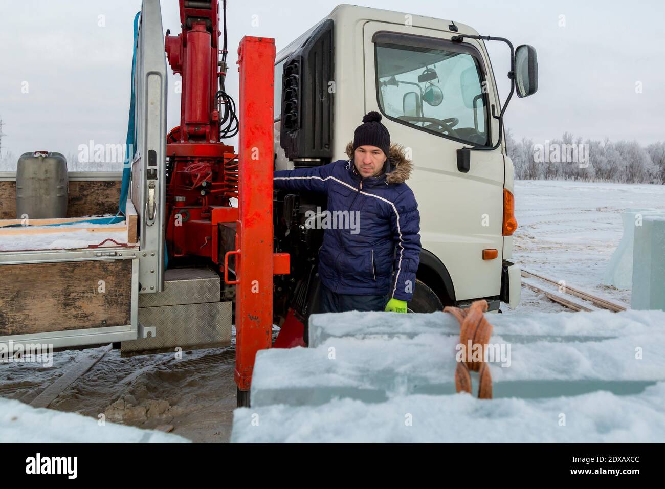 The hydraulic manipulator driver focuses on crane control Stock Photo ...