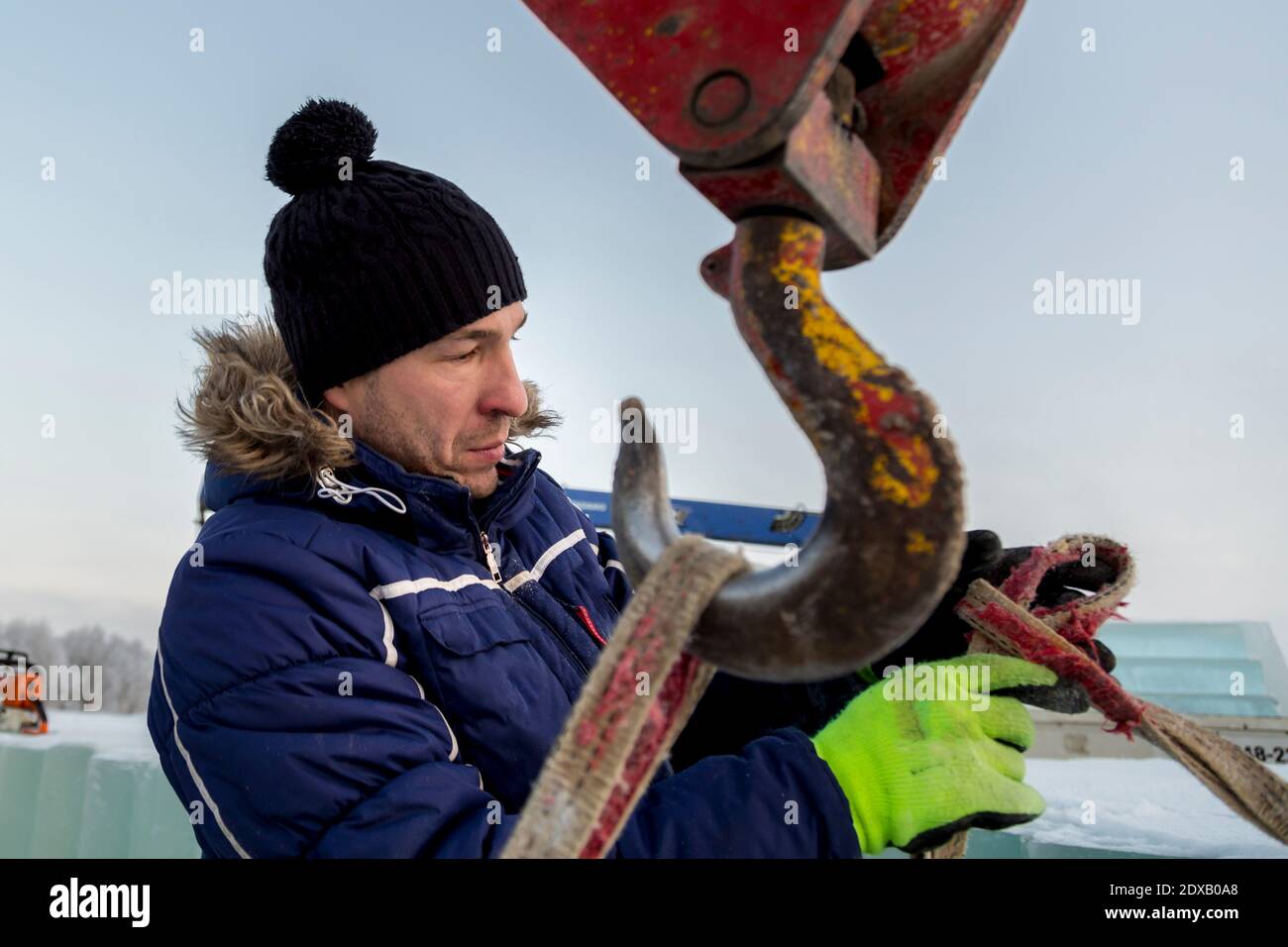 The slinger hooks the rope slings onto the hook of the truck crane ...