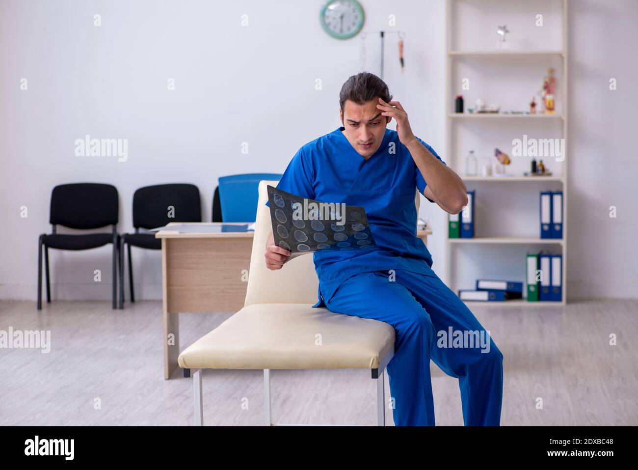 Young doctor radiologist being unhappy after night shift Stock Photo ...