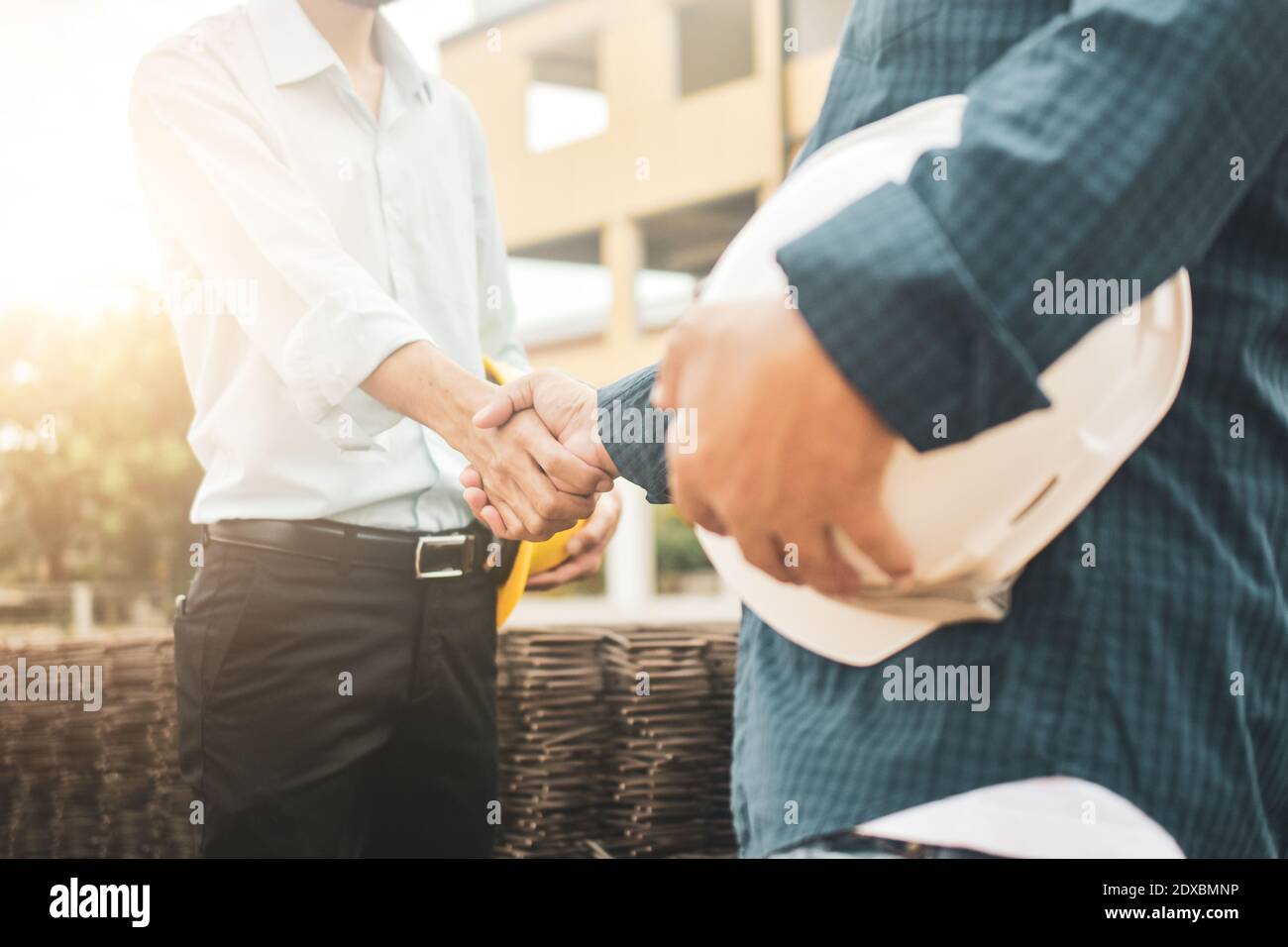 Business people shaking hands agreement success project estate building ...