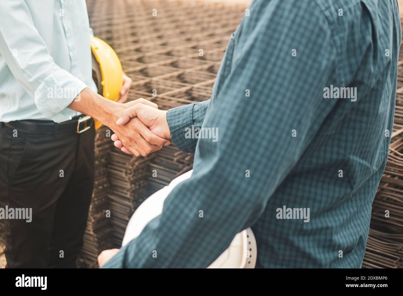 Business people shaking hands agreement success project estate building ...