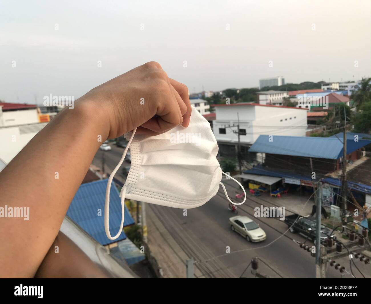 Hand holding disposable sanitation mask.Protect yourself from viruses ...