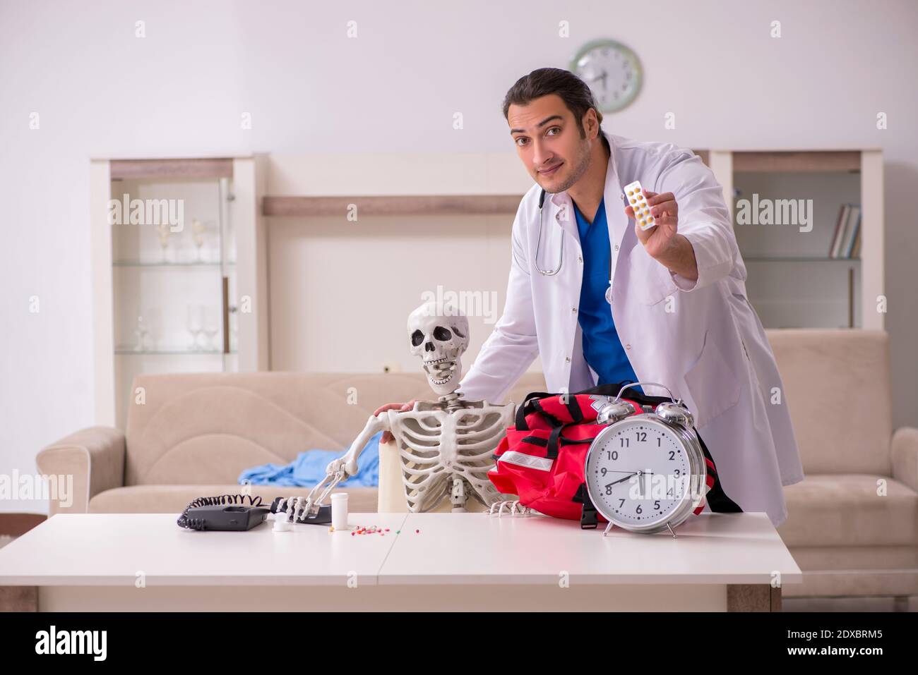 Male paramedic visiting skeleton patient Stock Photo - Alamy