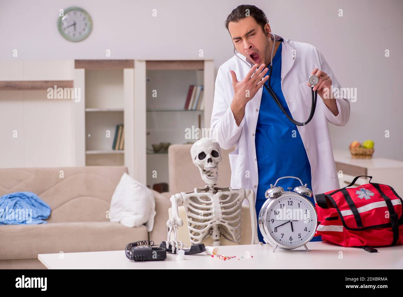 Male paramedic visiting skeleton patient Stock Photo - Alamy