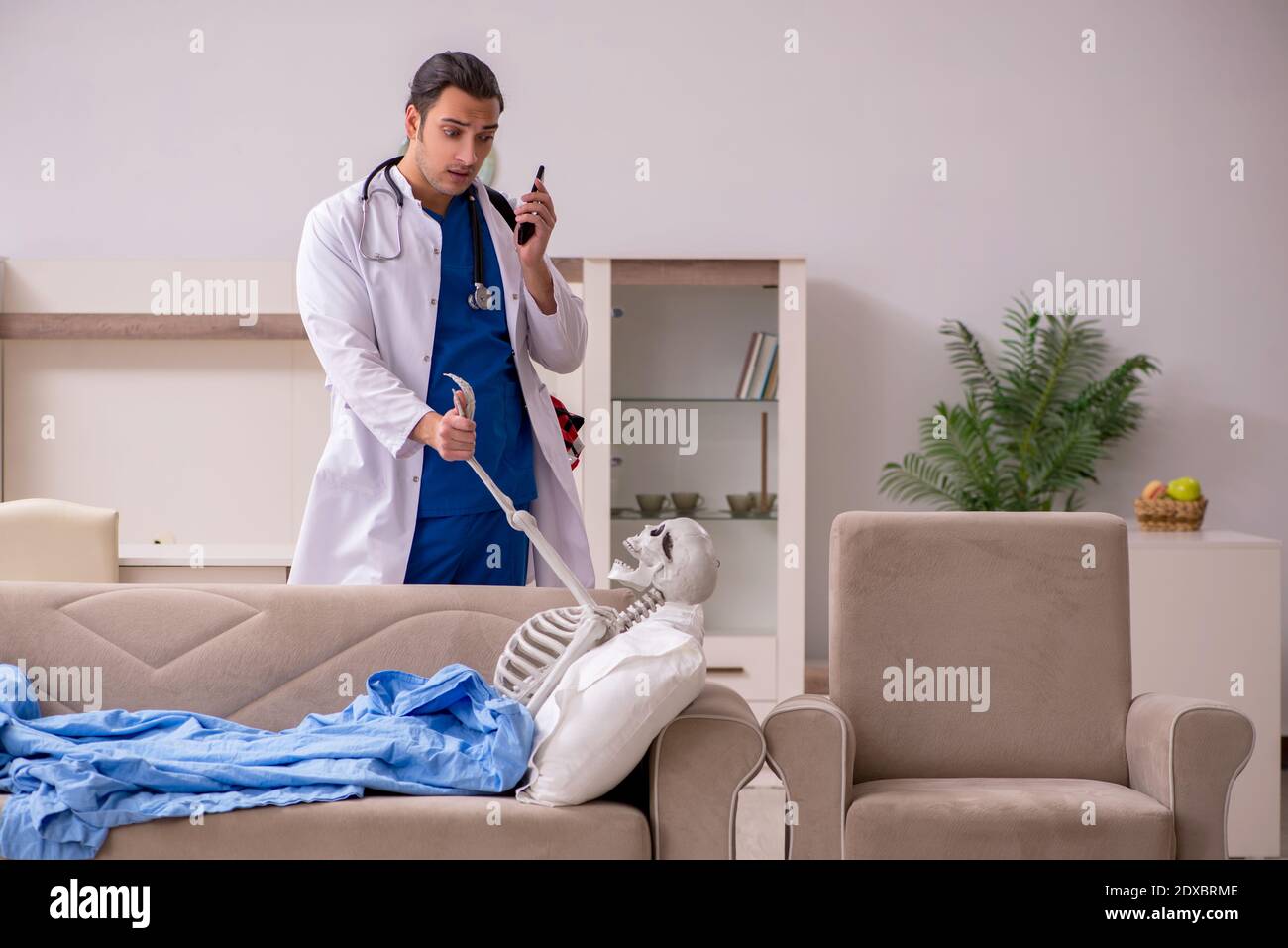 Male paramedic visiting skeleton patient Stock Photo - Alamy