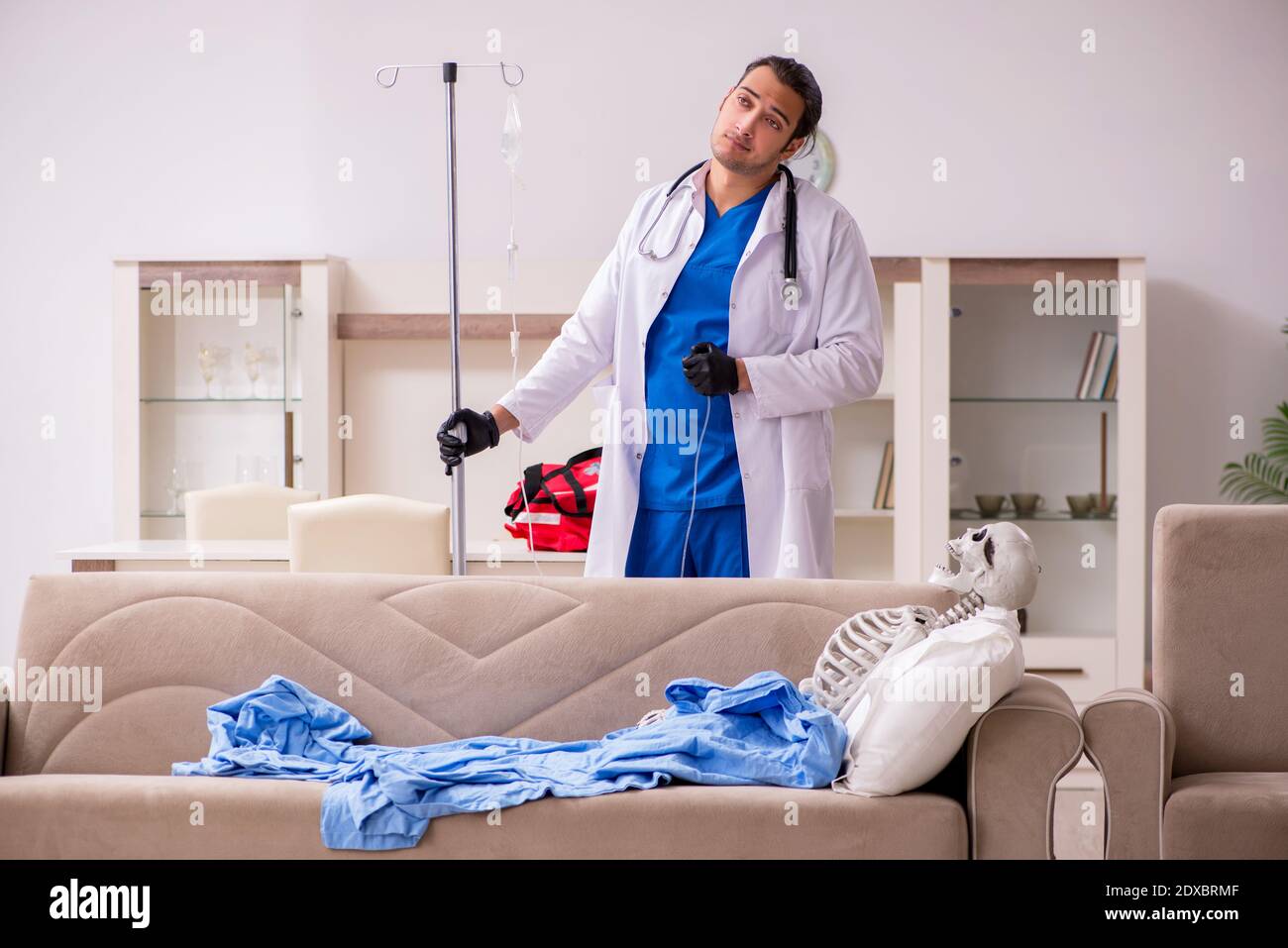 Male paramedic visiting skeleton patient Stock Photo - Alamy