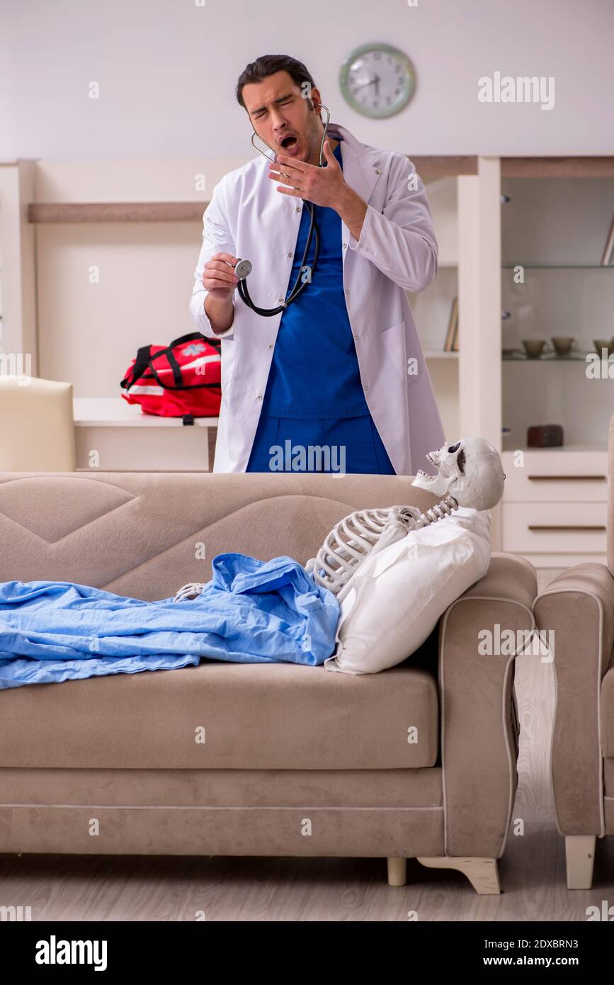 Male paramedic visiting skeleton patient Stock Photo - Alamy