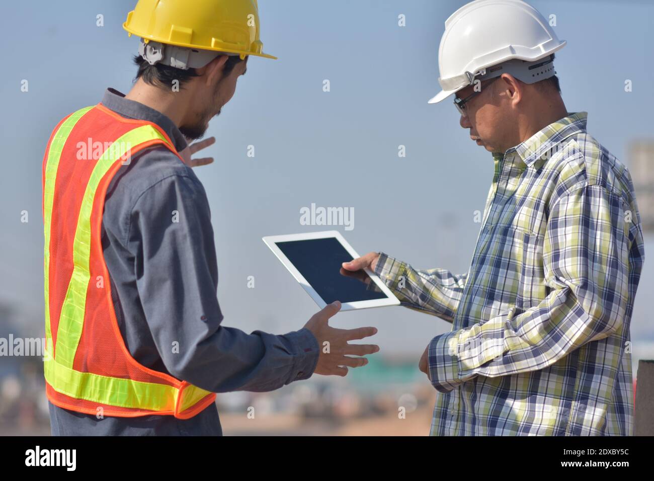 Construction Engineering use white tablet application working building ...