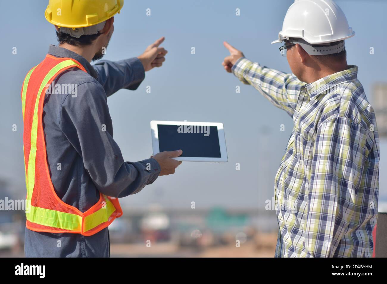 Construction Engineering use white tablet application working building ...