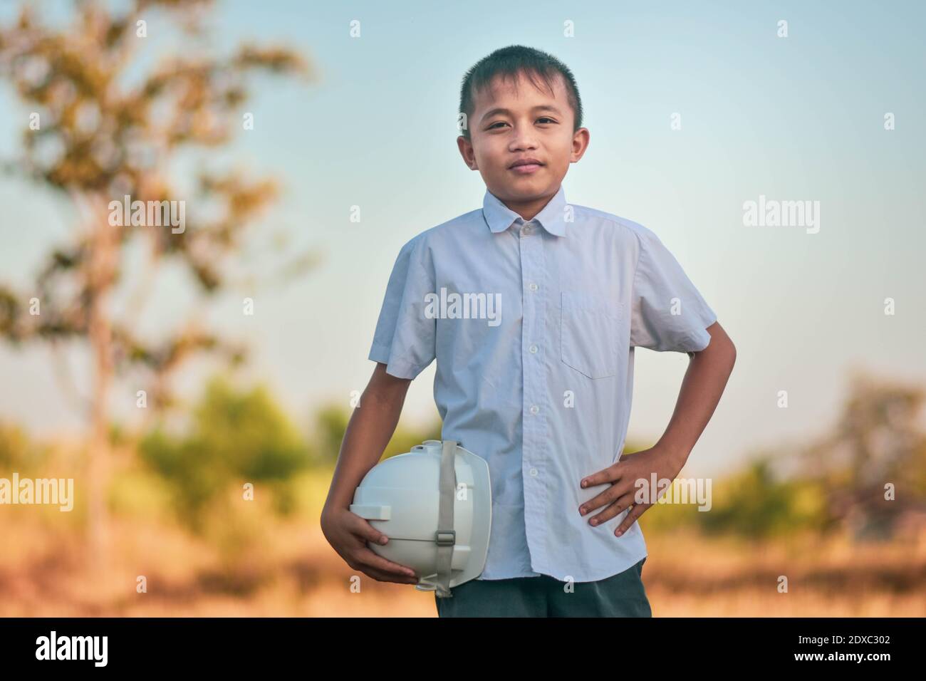 Boy Kid Engineer holding helmet Dream to Engineering future concept ...