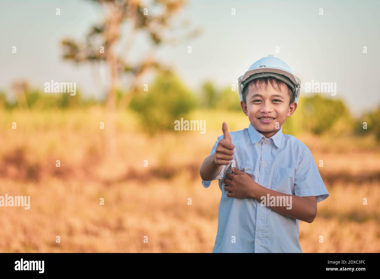 Boy kid Engineer standing outdoor holding hand success concept Stock ...