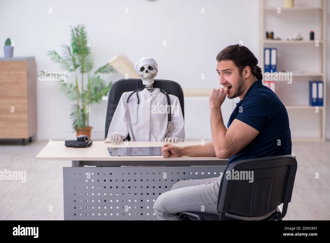 Young man visiting dead doctor in hospital Stock Photo - Alamy