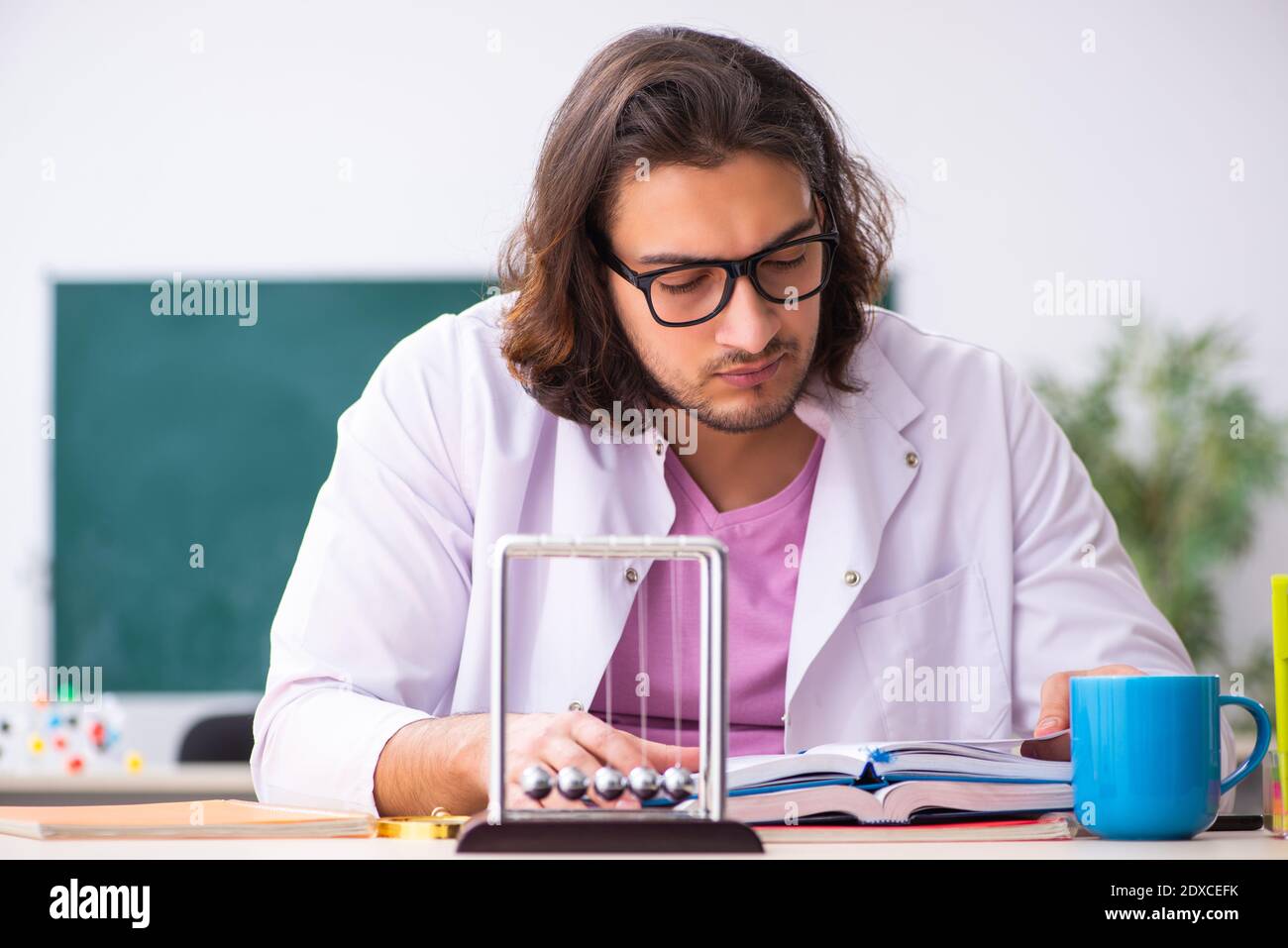 Young physicist in the classroom Stock Photo - Alamy
