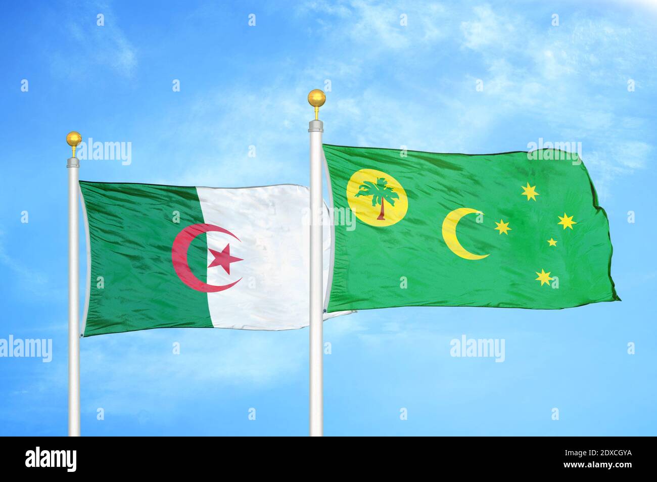 Algeria and Cocos Keeling Islands two flags on flagpoles and blue sky ...