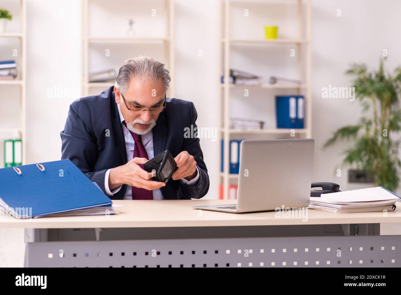 Old businessman in bankruptcy concept Stock Photo - Alamy