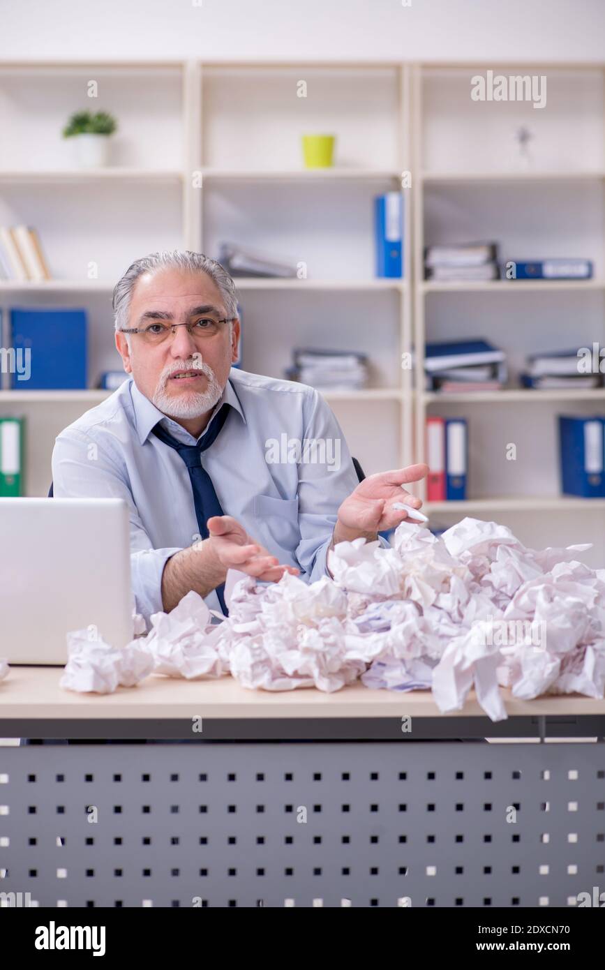 Old businessman rejecting ideas with lots of papers Stock Photo - Alamy