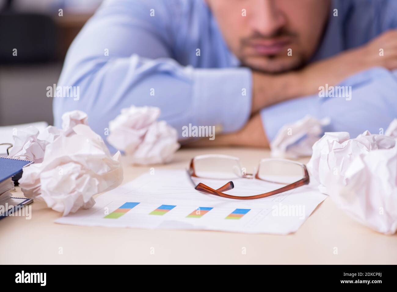 Sick male employee suffering at the workplace Stock Photo - Alamy