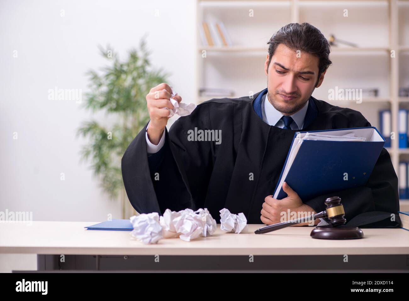 Young judge working in courthouse Stock Photo - Alamy