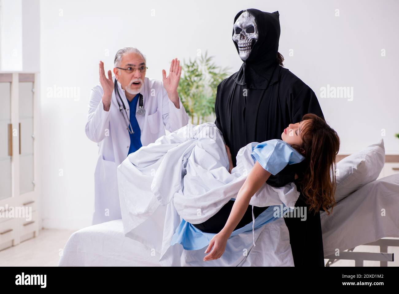 Devil, old doctor and female patient in clinic Stock Photo - Alamy